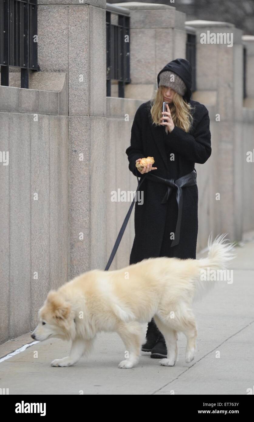 Suki Waterhouse out walking her dog on a cold day in Manhattan. She ...