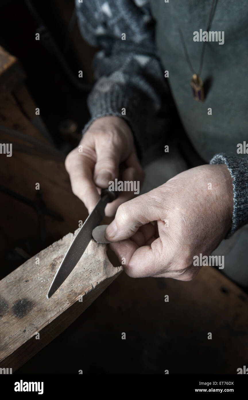 Senior male goldsmith shaping crystal hi-res stock photography and ...