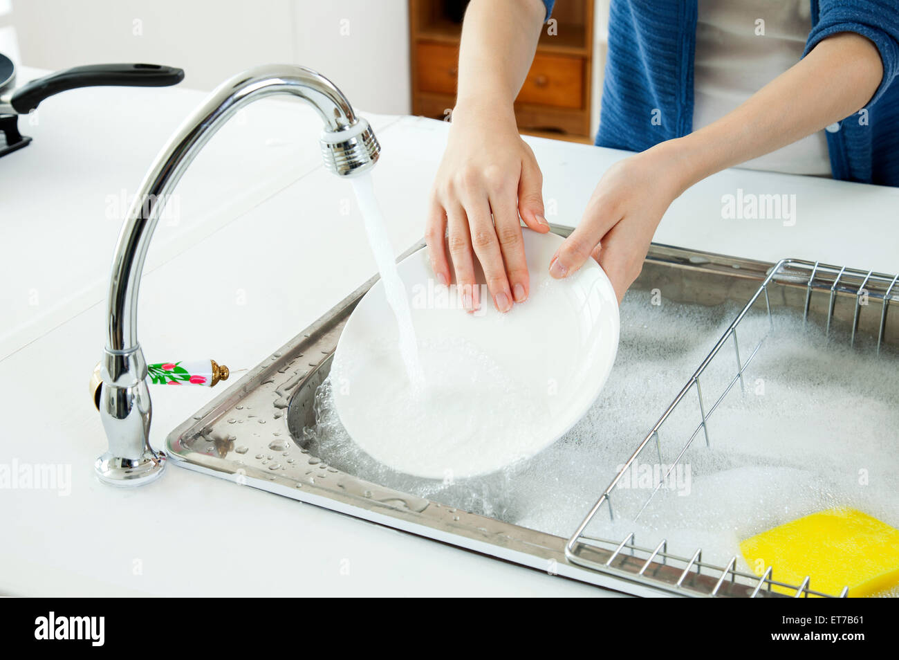 Human hands washing plate Stock Photo - Alamy