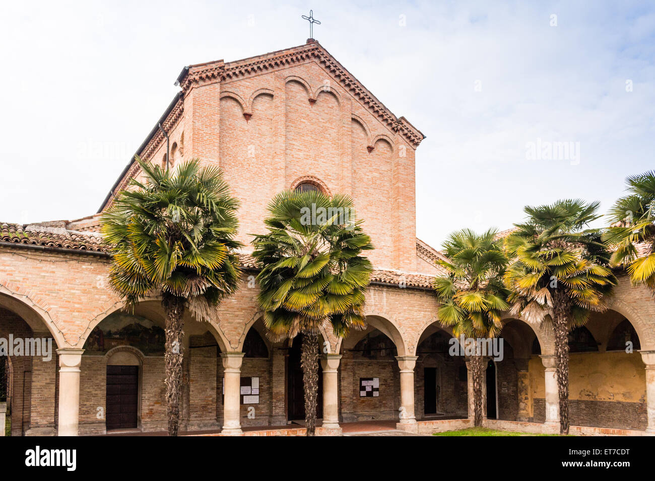 Brickwall facade and colonnade with archs of the XV century roman ...