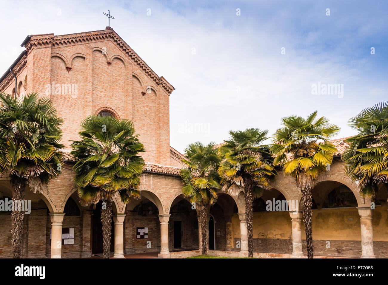 Brickwall facade and colonnade with archs of the XV century roman ...