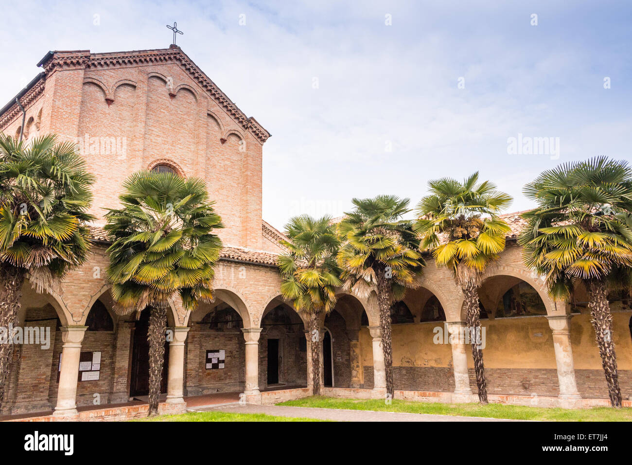Brickwall facade and colonnade with archs of the XV century roman ...
