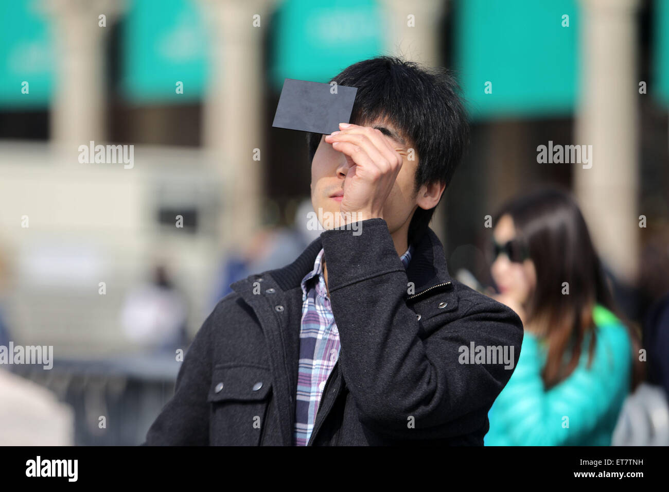 People watch the solar eclipse from Duomo Square Where: Milan, Italy ...