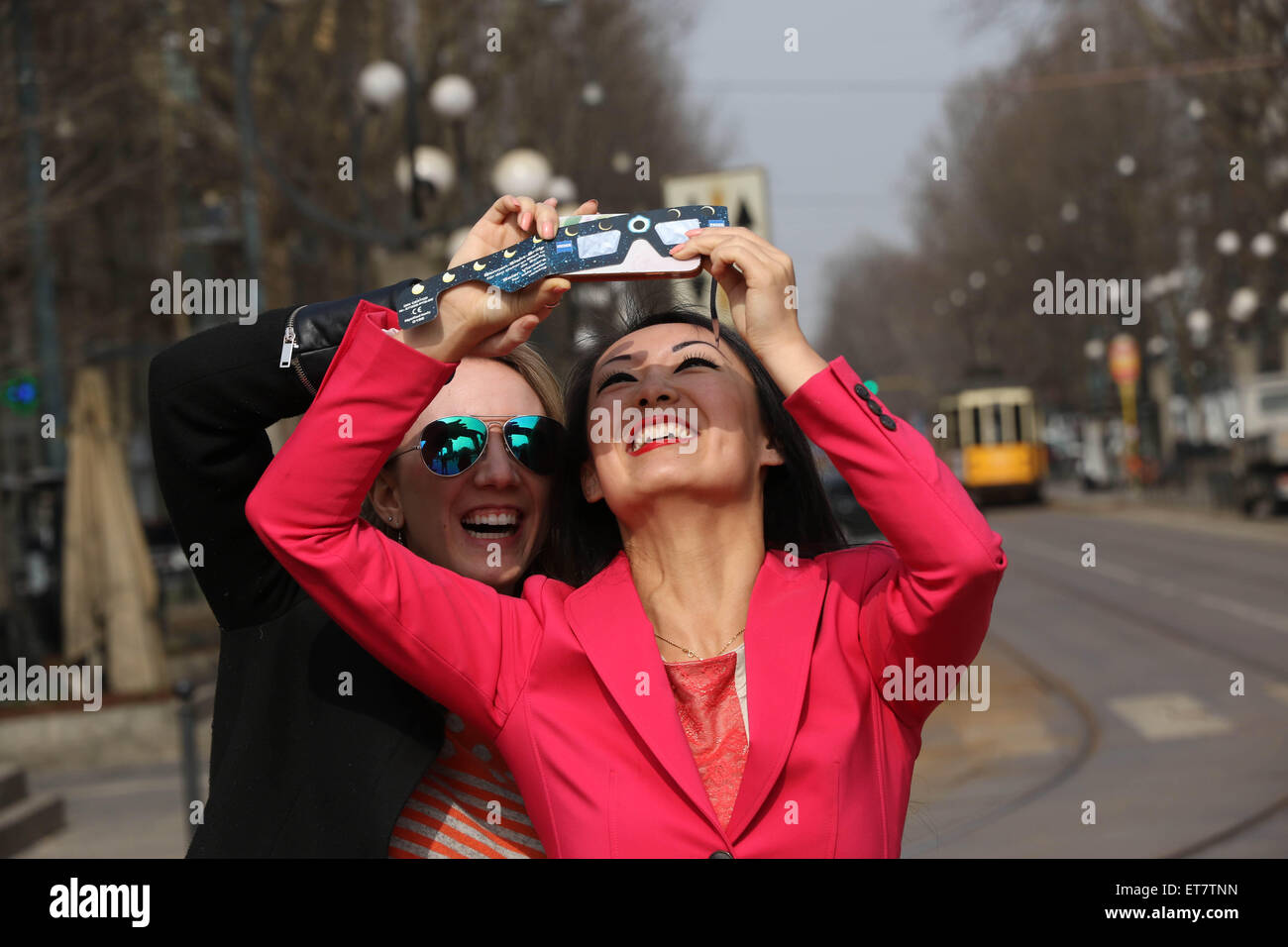 People watch the solar eclipse from Arco della Pace Where: Milan, Italy ...