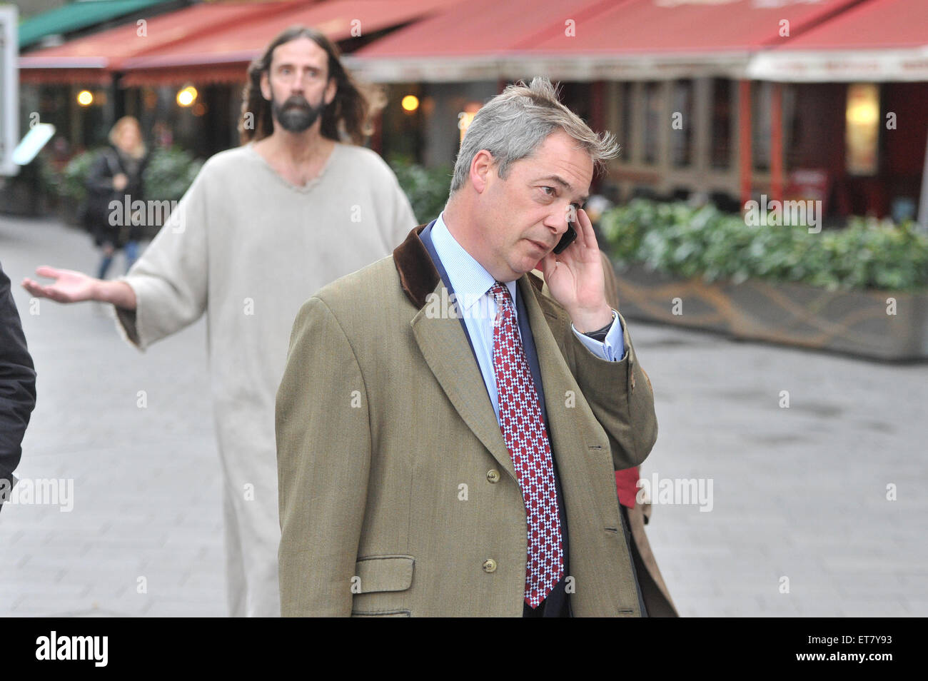 Nigel Farage is met by Kevin Lee Light, aka Jesus of Hollywood, as he ...