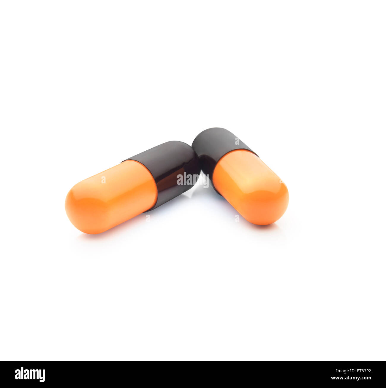 Two pills isolated on white background Stock Photo - Alamy
