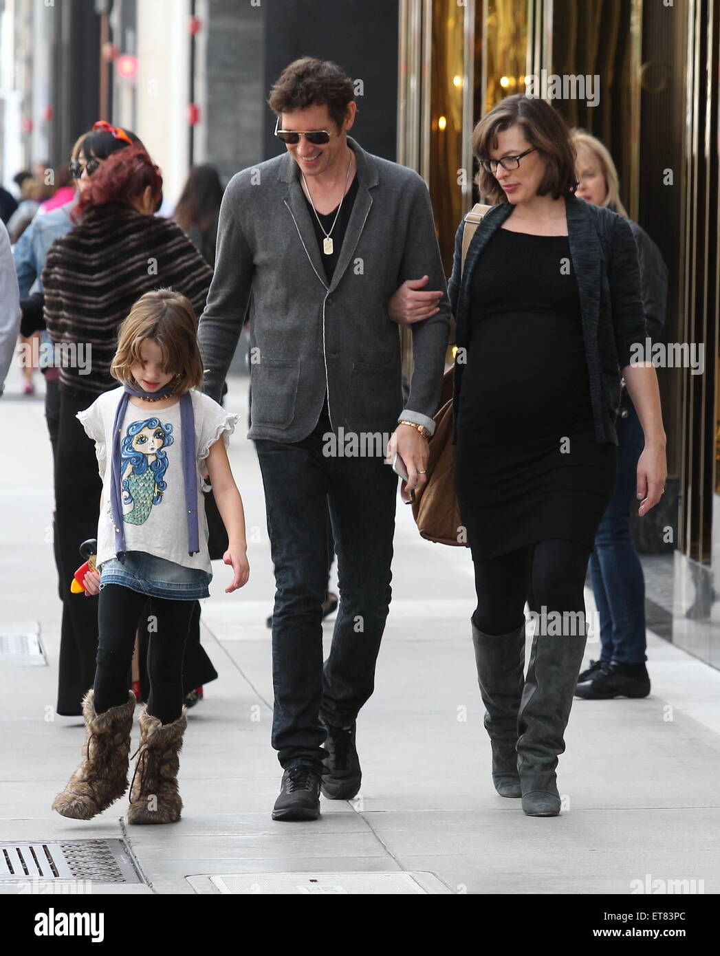 Pregnant Milla Jovovich spotted out with her husband Paul W. S ...