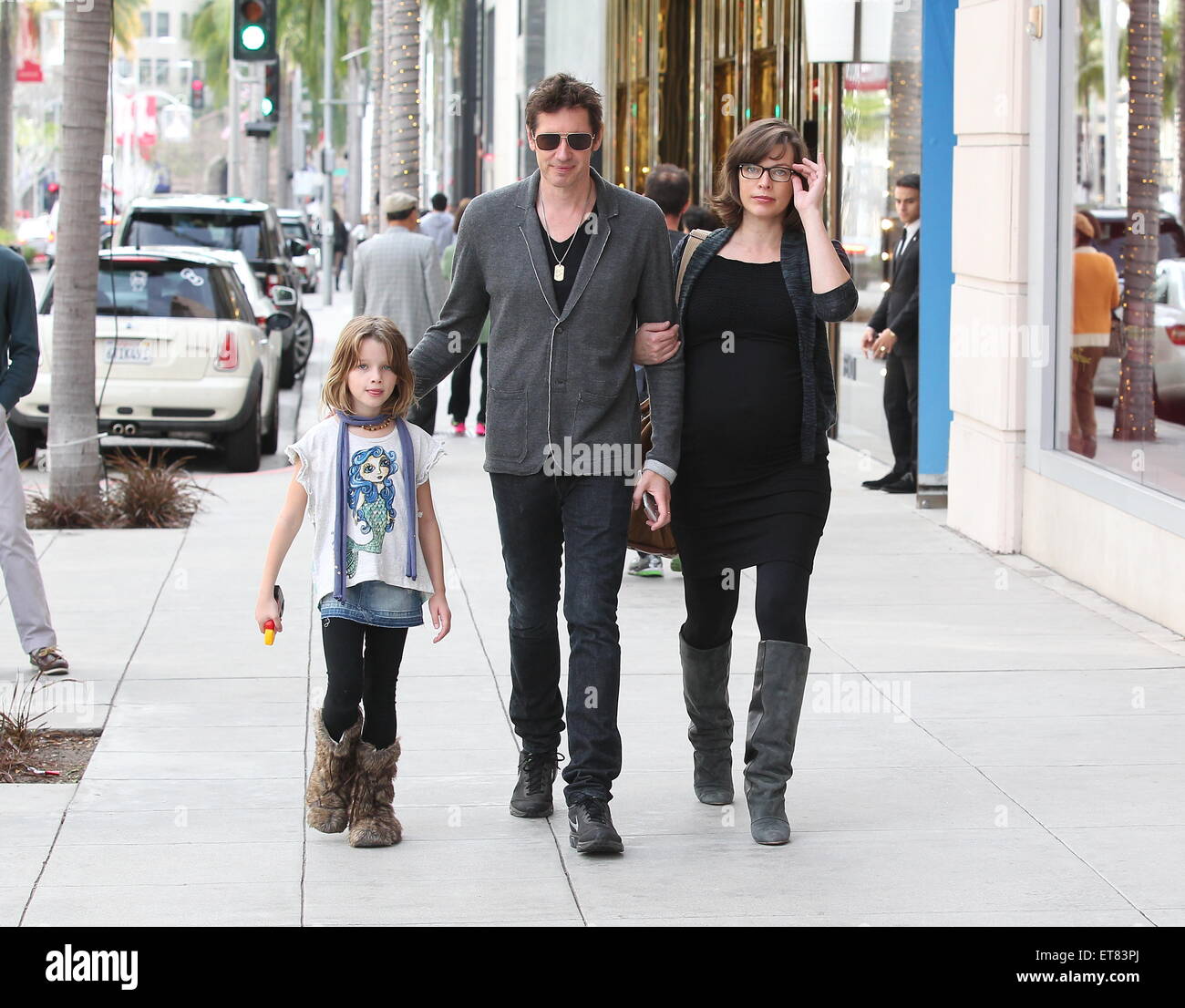 Pregnant Milla Jovovich spotted out with her husband Paul W. S ...