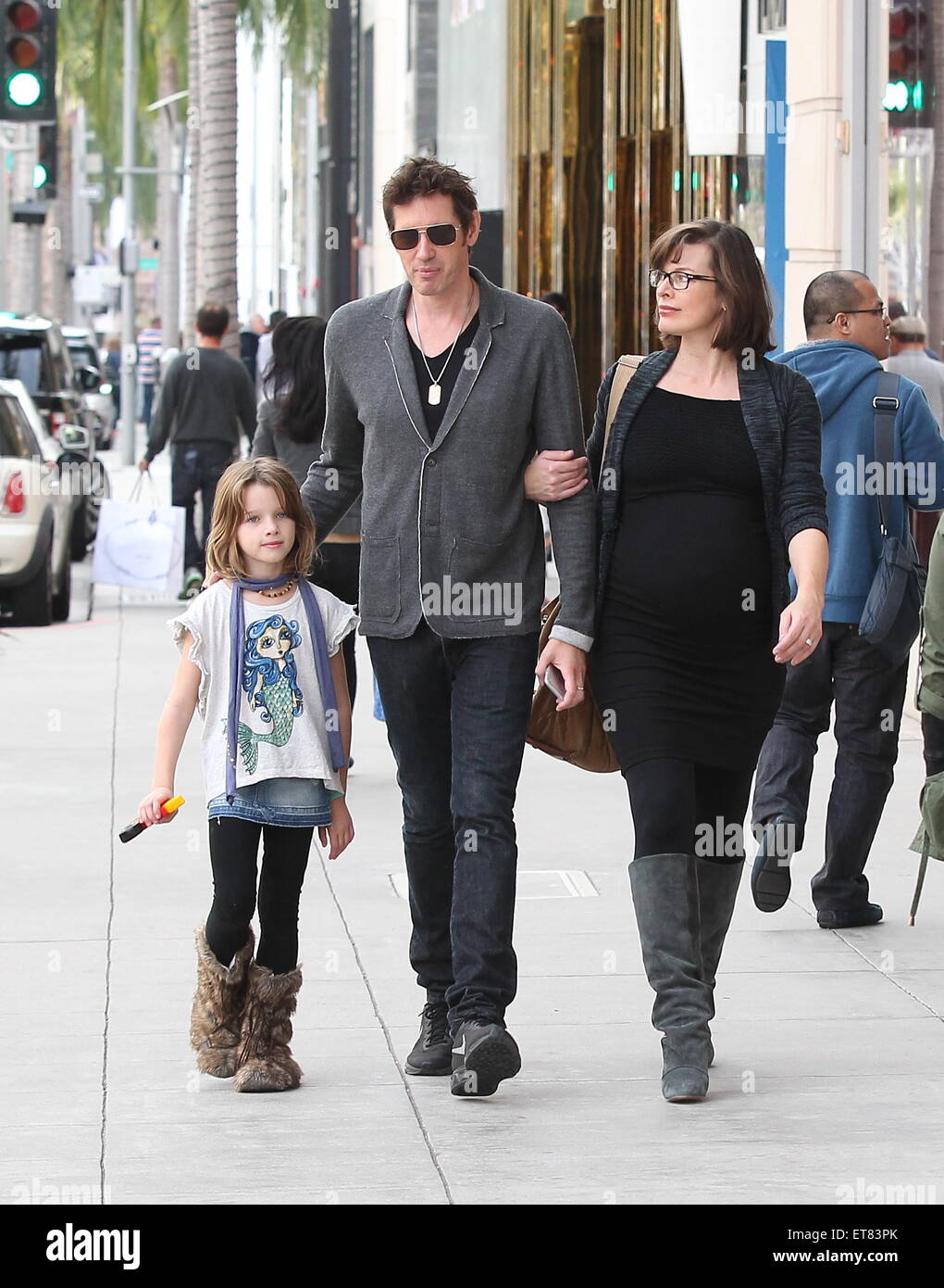Pregnant Milla Jovovich spotted out with her husband Paul W. S ...