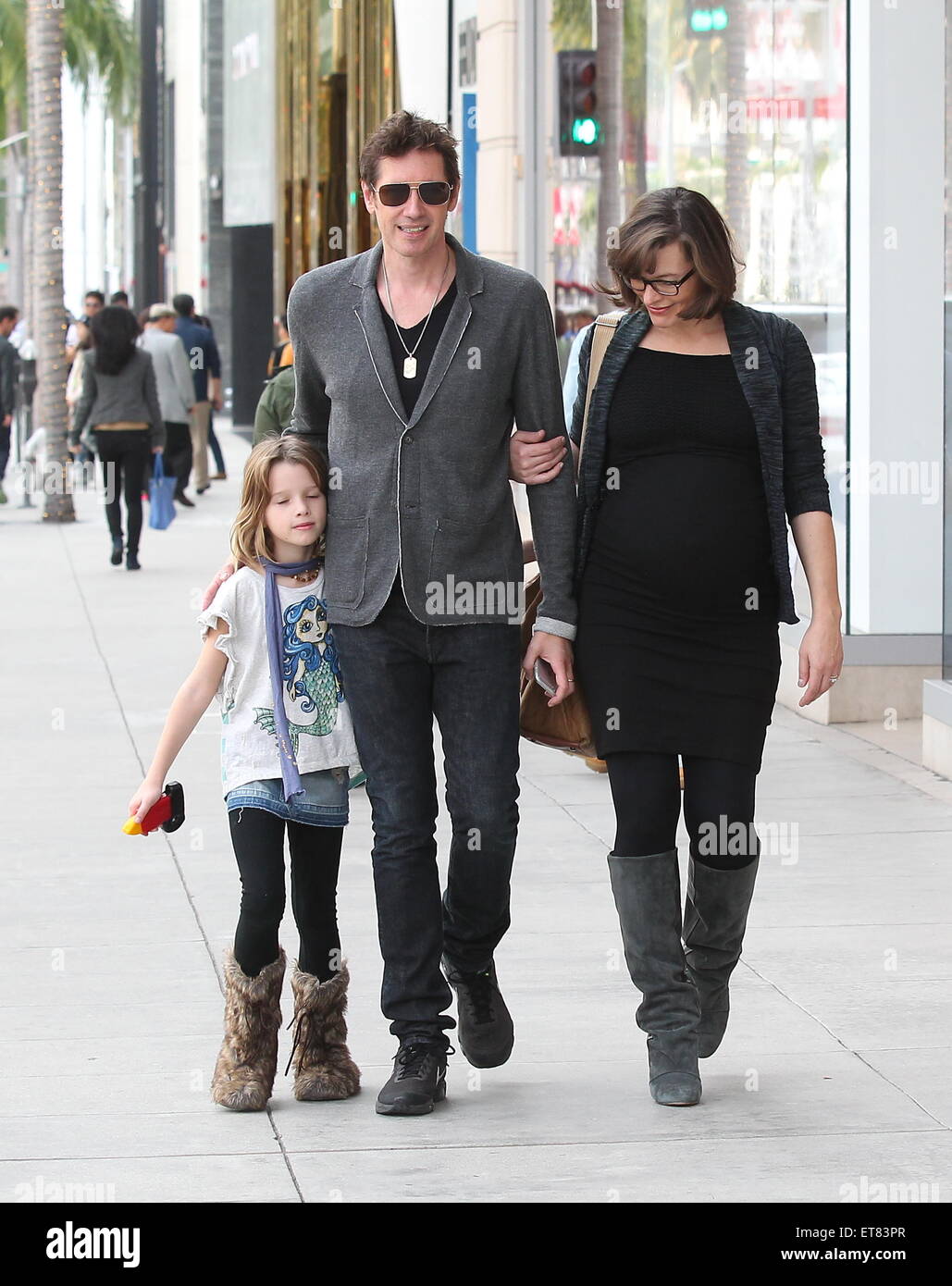Pregnant Milla Jovovich spotted out with her husband Paul W. S ...