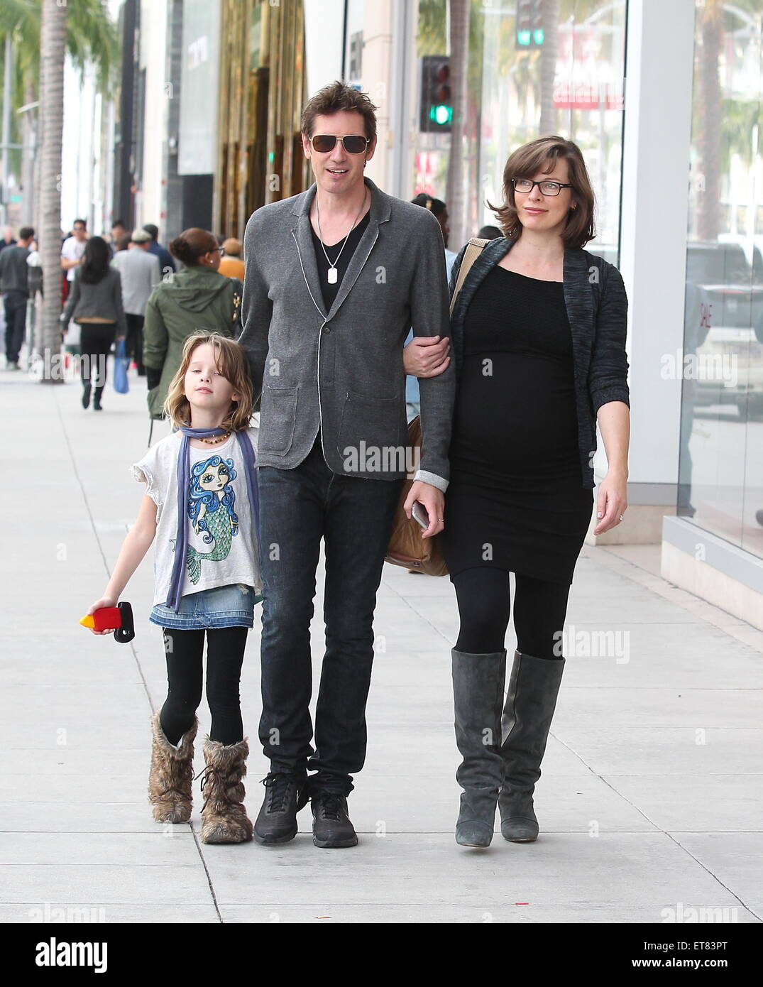 Pregnant Milla Jovovich spotted out with her husband Paul W. S ...