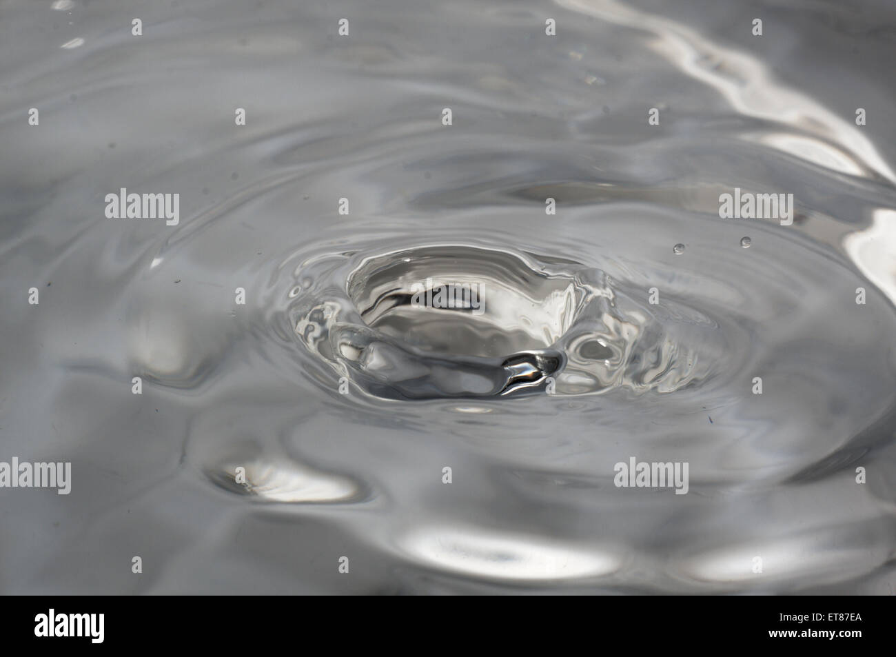 Splash of water drops falling from the top Stock Photo - Alamy