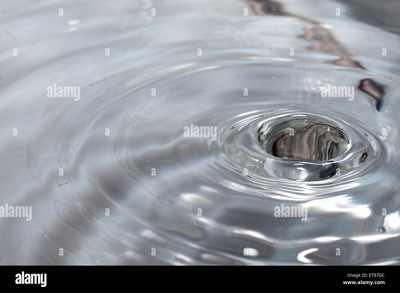 Splash of water drops falling from the top Stock Photo - Alamy