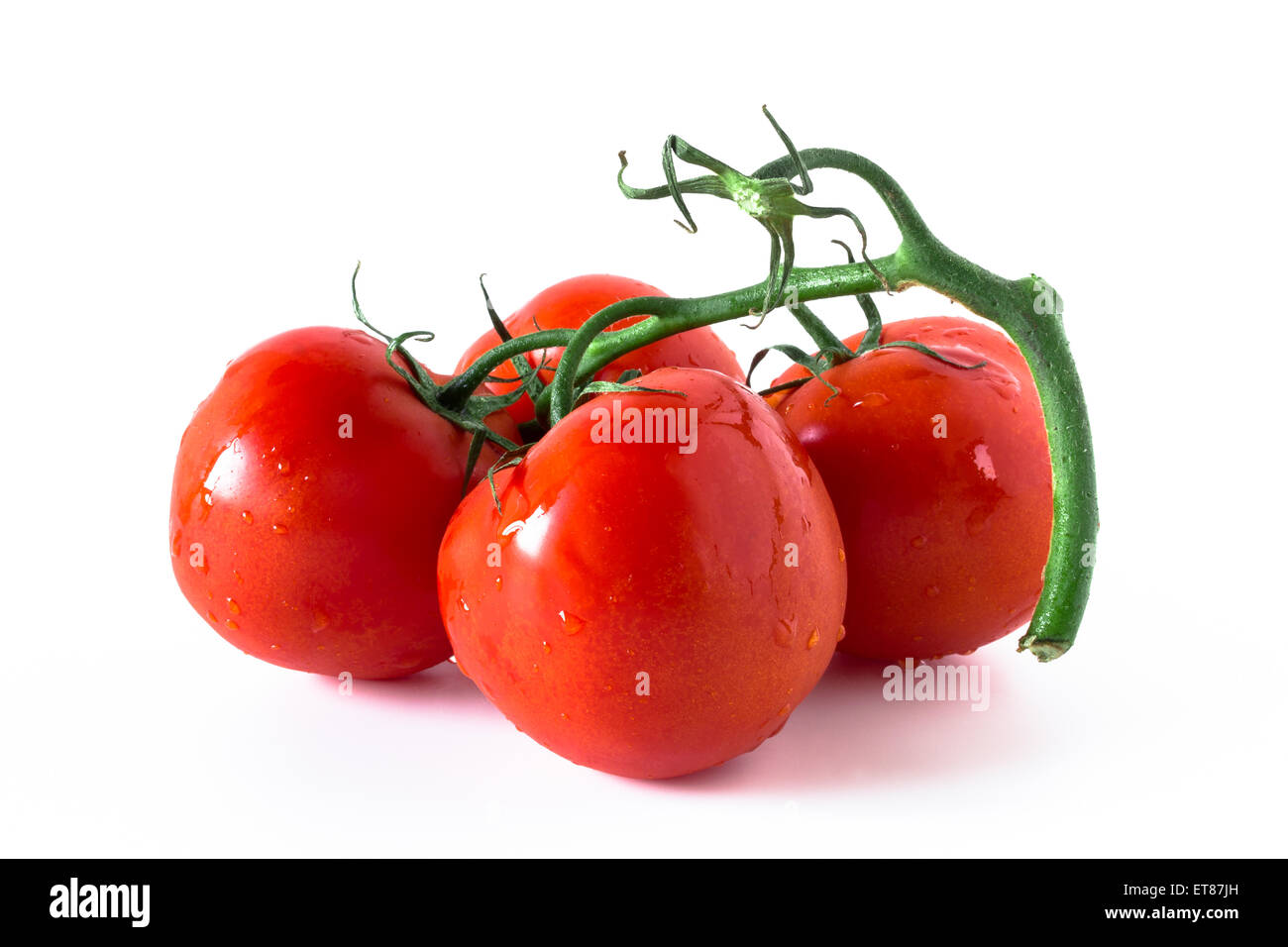 Four tomatoes washed, isolated on a white background Stock Photo - Alamy