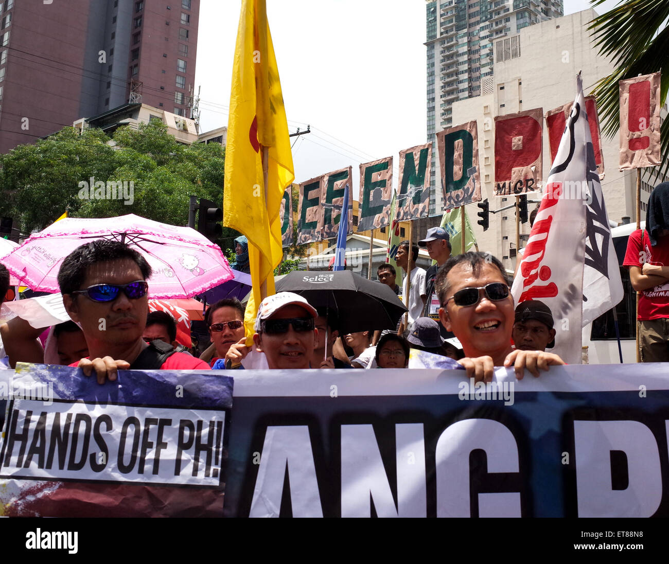 Manila, Philippines. 12th June, 2015. Protesters listen to a speaker ...