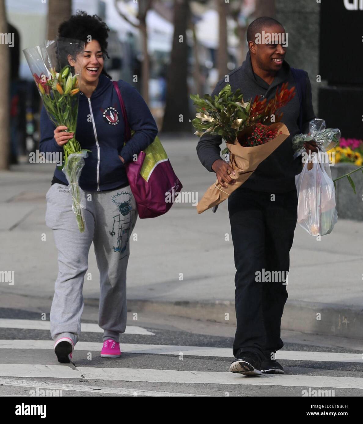 Keith Powell and his wife, Jill Knox purchase flowers from the Farmer's ...