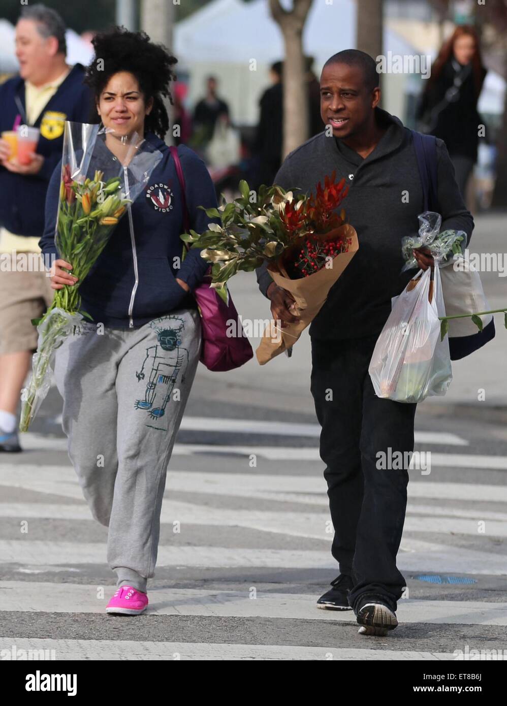 Keith Powell and his wife, Jill Knox purchase flowers from the Farmer's ...