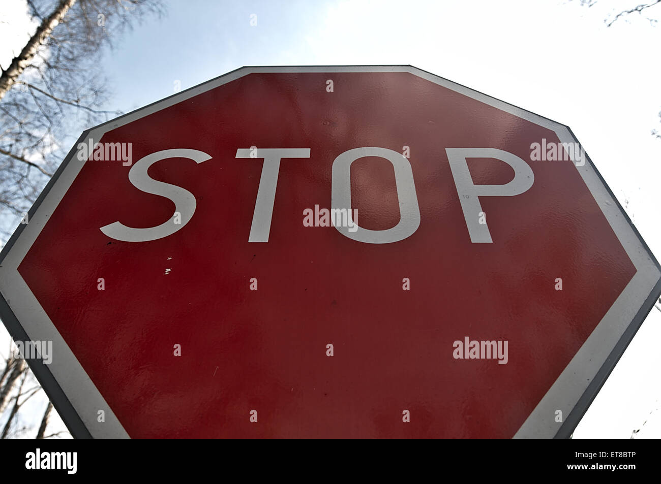 Road stop sign standing on the street Stock Photo - Alamy
