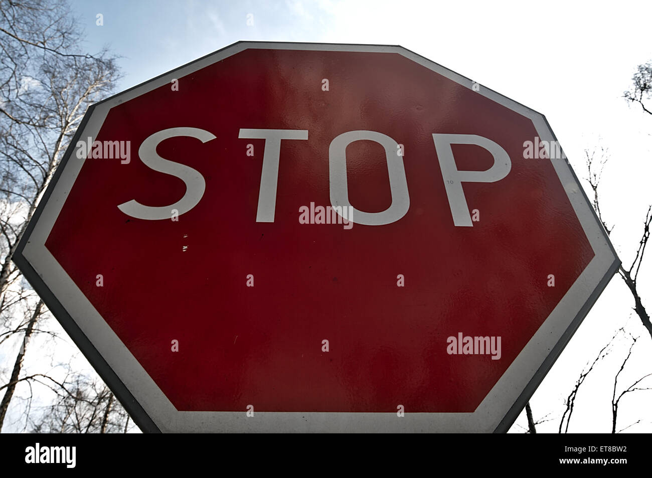 Road stop sign standing on the street Stock Photo - Alamy