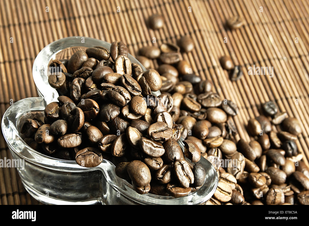 Coffee beans scattered on the table. The visible structure of the ...