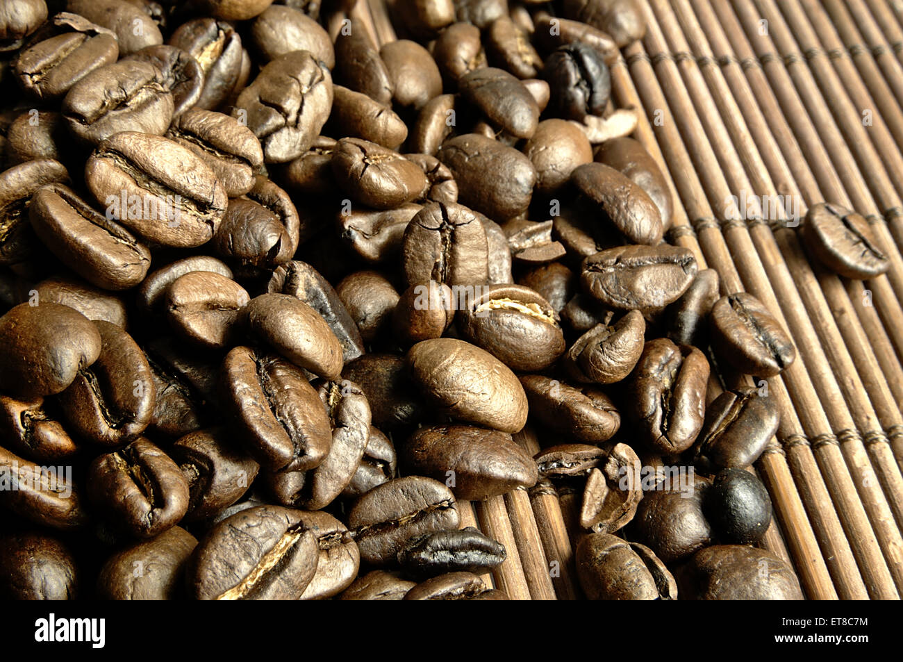 Coffee beans scattered on the table. The visible structure of the ...