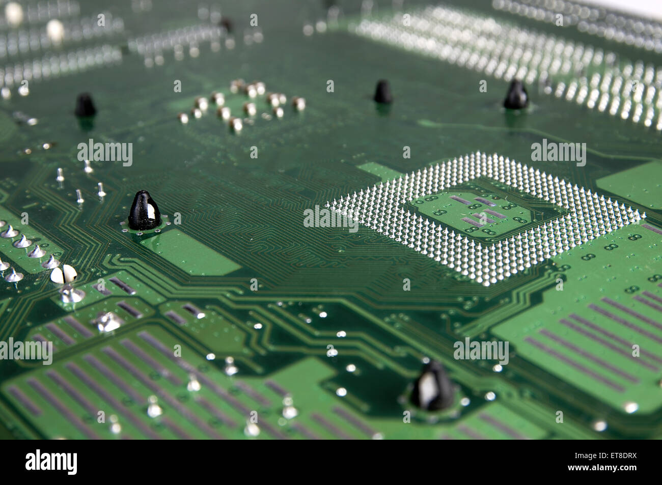 Close up of the surface of an old computer motherboard. Visible ...