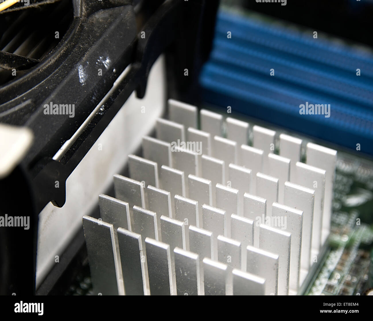Radiator, silver and aluminum. On the motherboard with visible ...