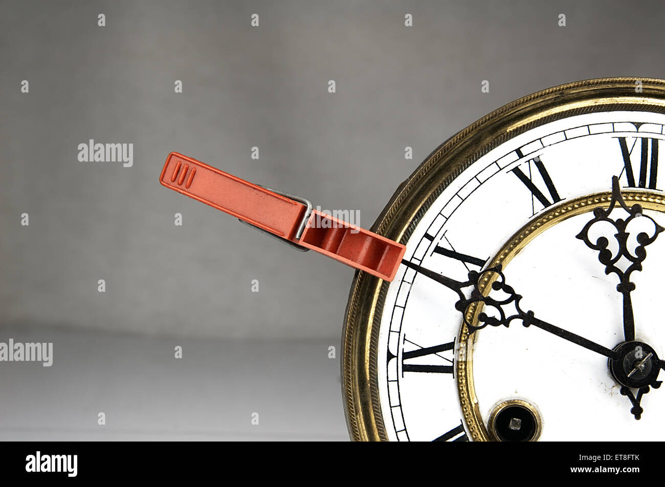 Red Clothespin. Pinned to the Old Clock and stopping time Stock Photo ...