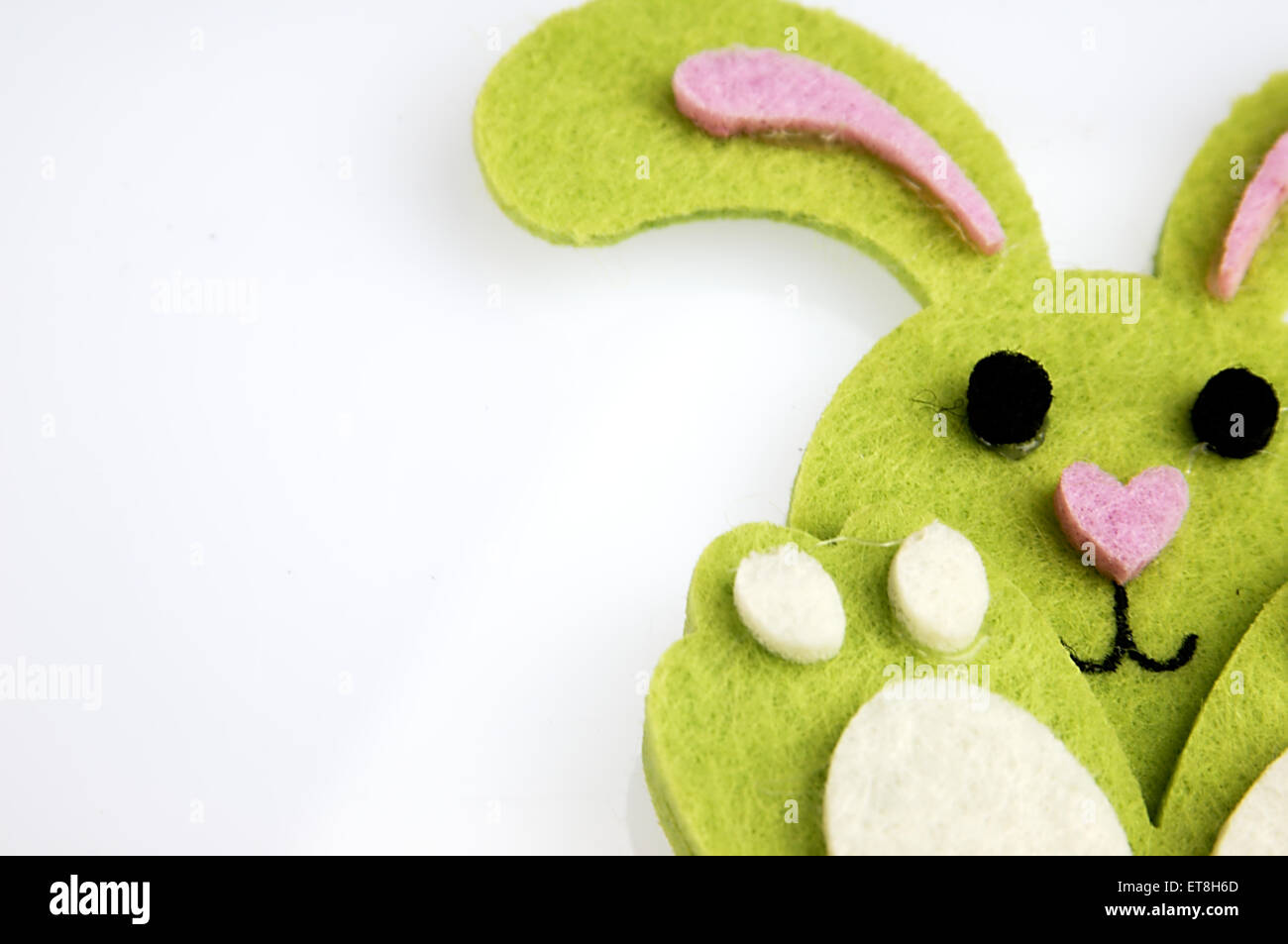 Green Rabbit toy. Easter symbol seen close up on white background Stock ...
