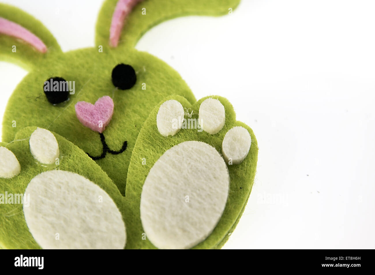 Green Rabbit toy. Easter symbol seen close up on white background Stock ...