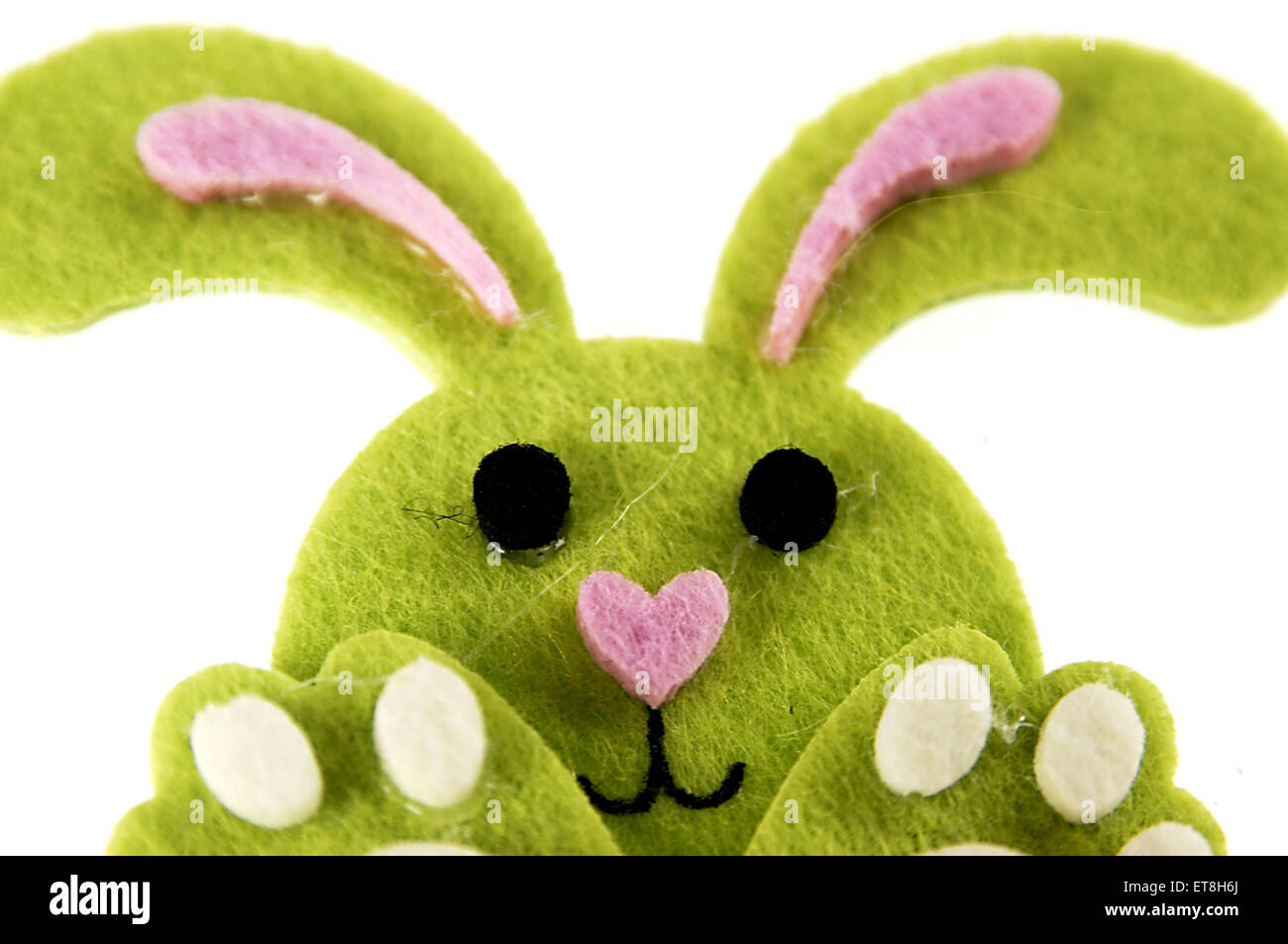 Green Rabbit toy. Easter symbol seen close up on white background Stock ...