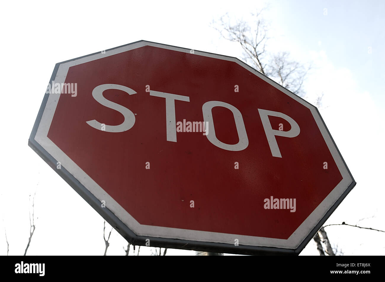 Road stop sign standing on the street Stock Photo - Alamy