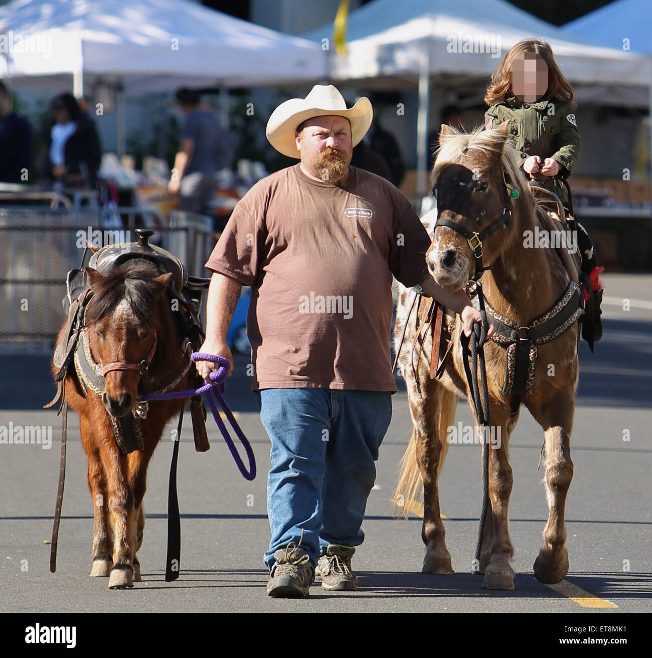 Skyler Berman rides a pony at the Farmers Market in Beverly Hills ...