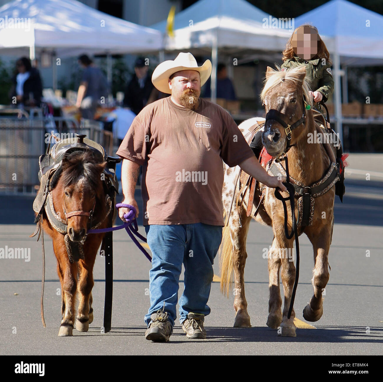 Skyler Berman rides a pony at the Farmers Market in Beverly Hills ...