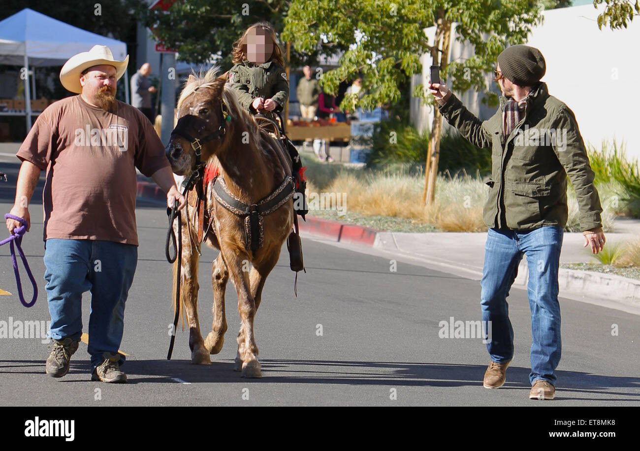 Rodger Berman takes his son, Skyler to ride a pony at the Farmers ...