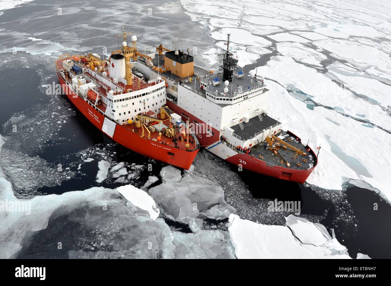 US Coast Guard Cutter Healy breaks ice alongside the Canadian Coast ...