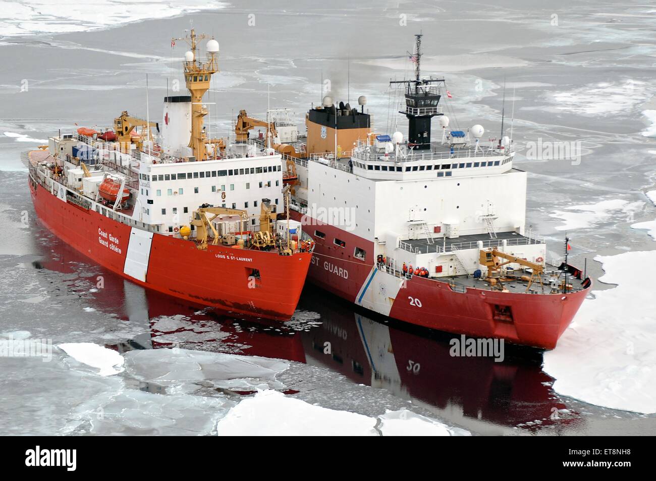 US Coast Guard Cutter Healy breaks ice alongside the Canadian Coast ...