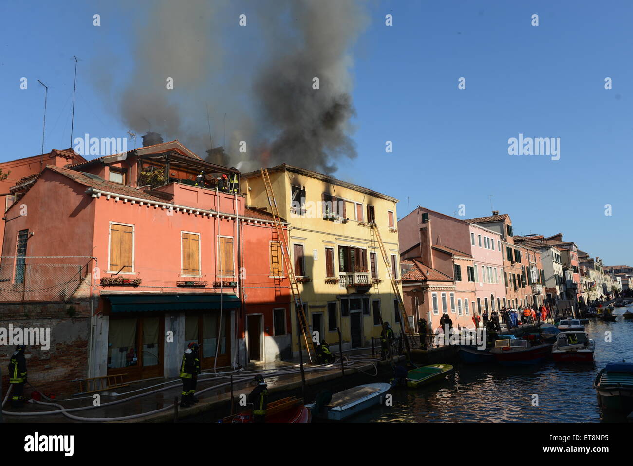 A fire breaks out on the roof of a building in the Cannaregio district ...