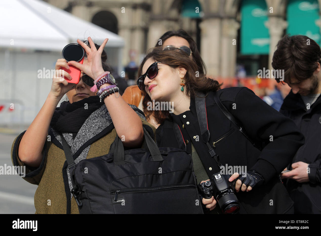 People watch the solar eclipse from Duomo Square Where: Milan, Italy ...