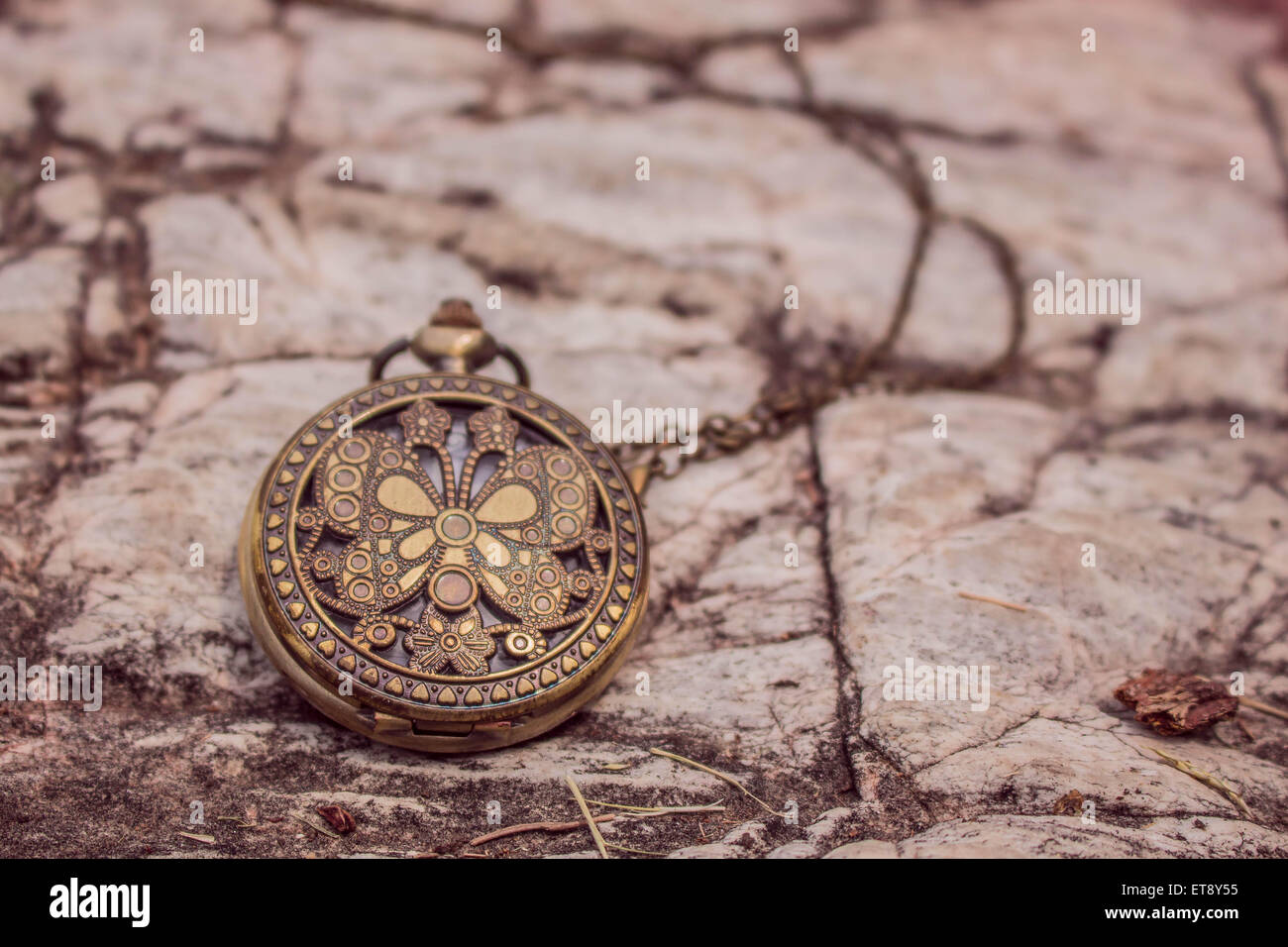 Classic clock on rock background Stock Photo - Alamy