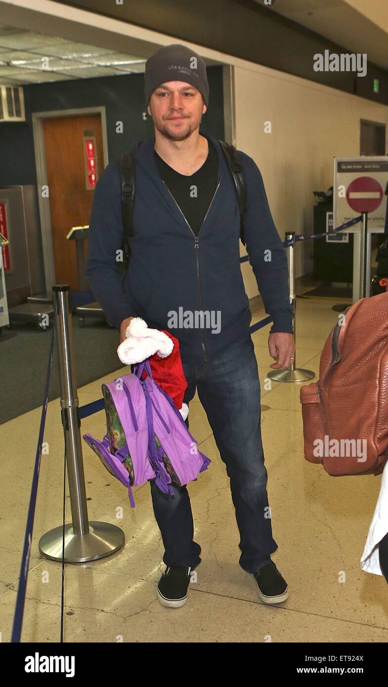 Matt Damon arrives at Los Angeles International Airport (LAX) carrying ...