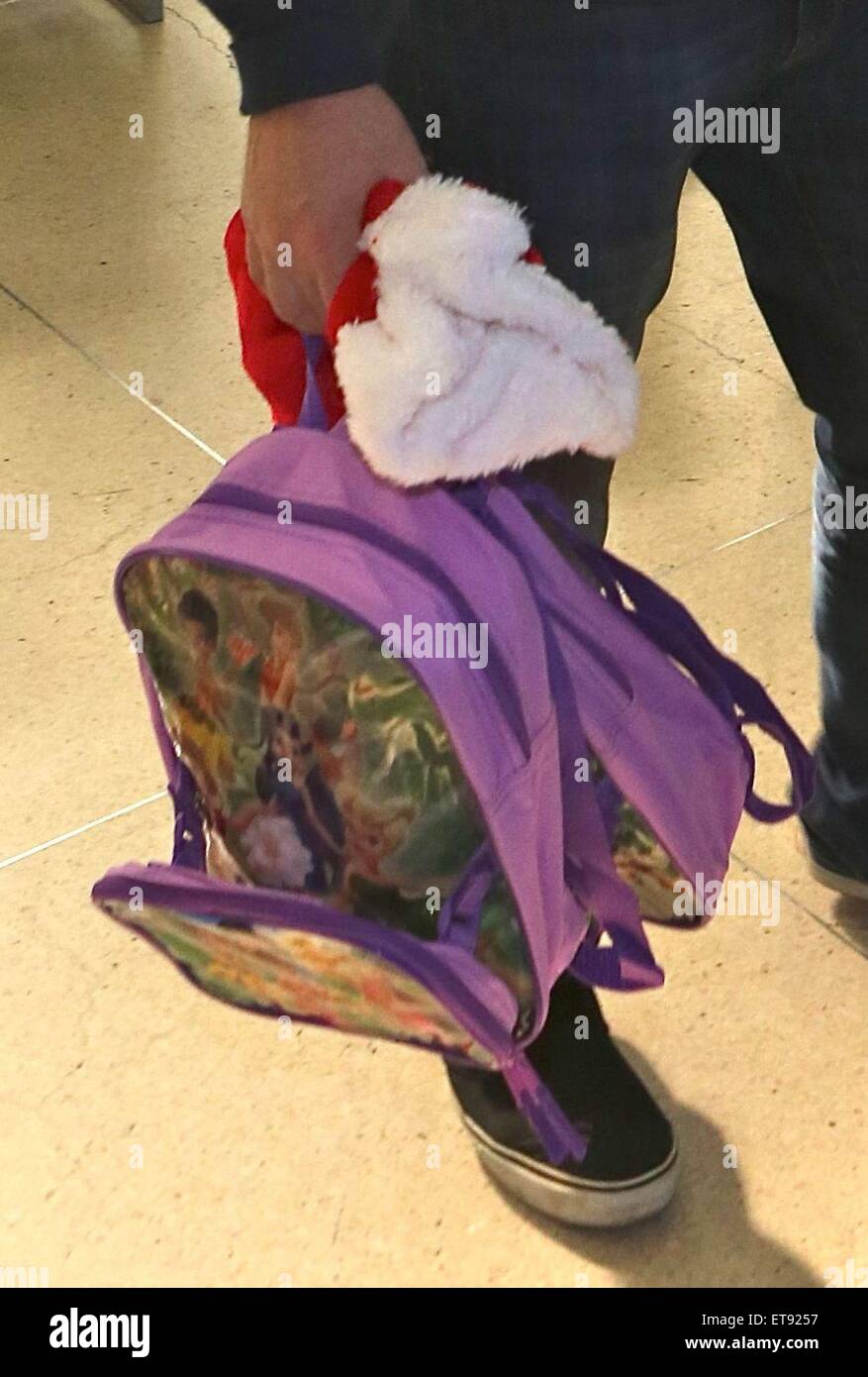 Matt Damon arrives at Los Angeles International Airport (LAX) carrying ...