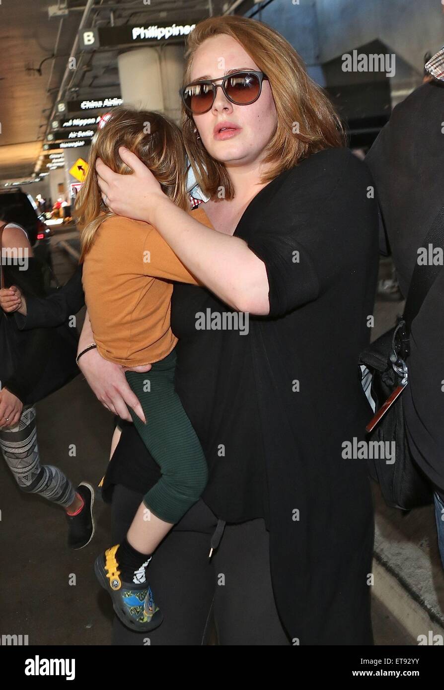 Adele arrives at Los Angeles International (LAX) airport carrying her son Angelo Featuring ...