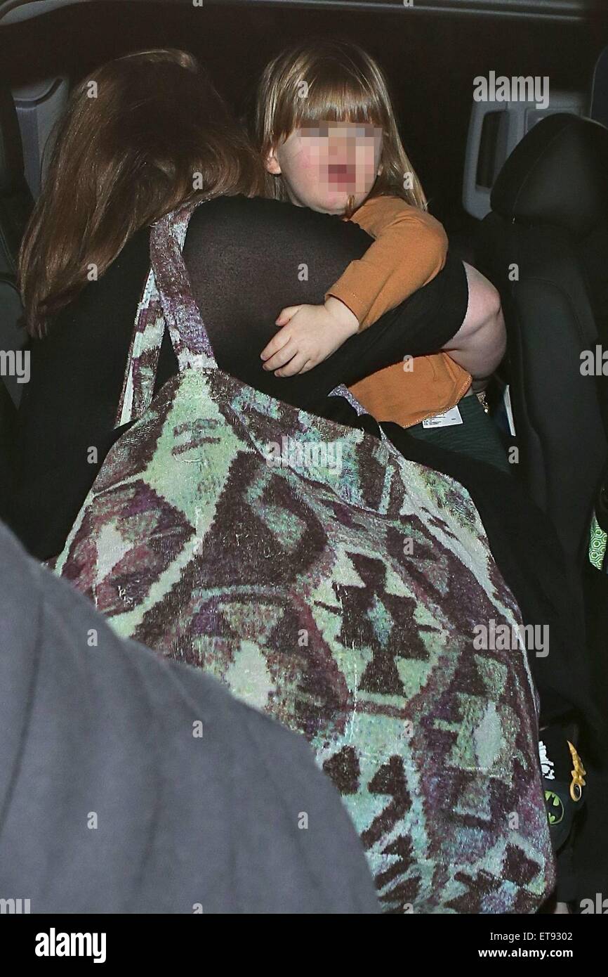 Adele arrives at Los Angeles International (LAX) airport carrying her ...