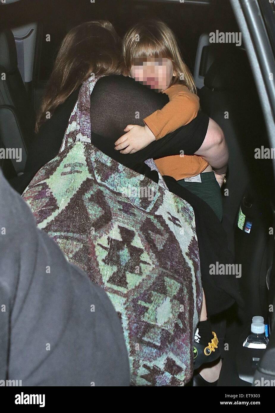 Adele arrives at Los Angeles International (LAX) airport carrying her ...