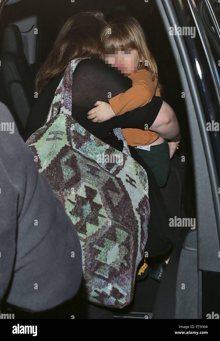 Adele arrives at Los Angeles International (LAX) airport carrying her ...