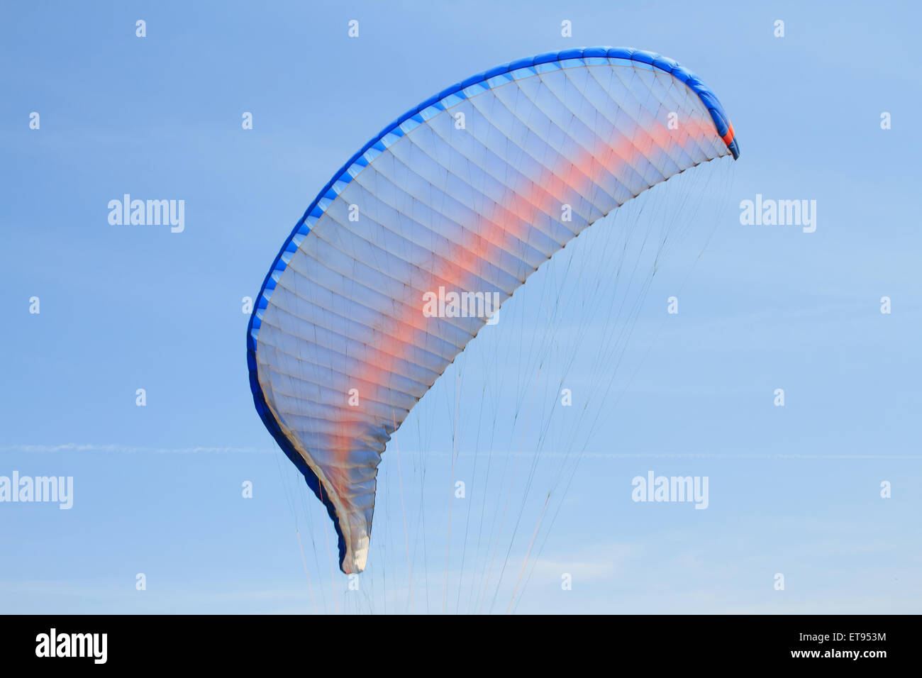 paraglider wing over blue sky Stock Photo - Alamy