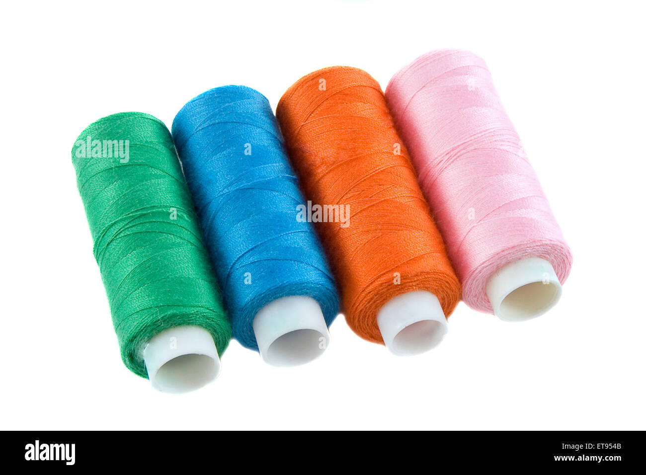 Many colorful threads over the white background Stock Photo - Alamy