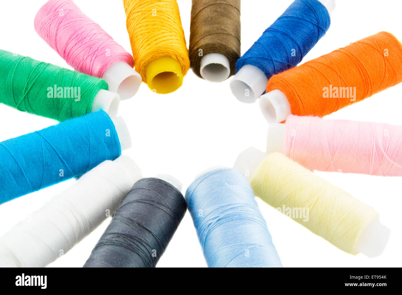 Many colorful threads over the white background Stock Photo - Alamy