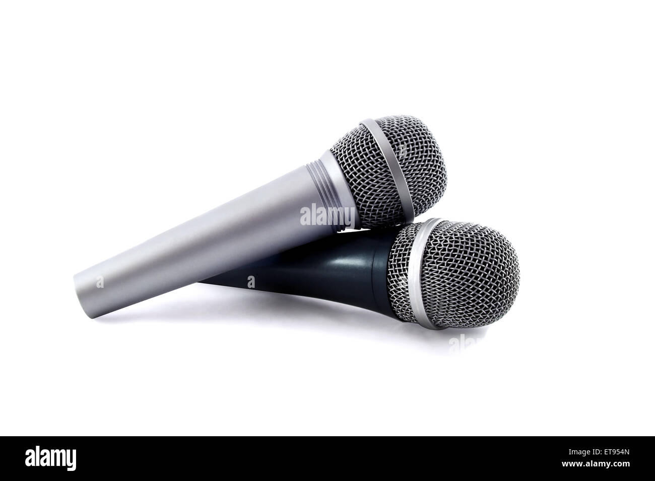 Two silver microphones isolated over white background Stock Photo - Alamy
